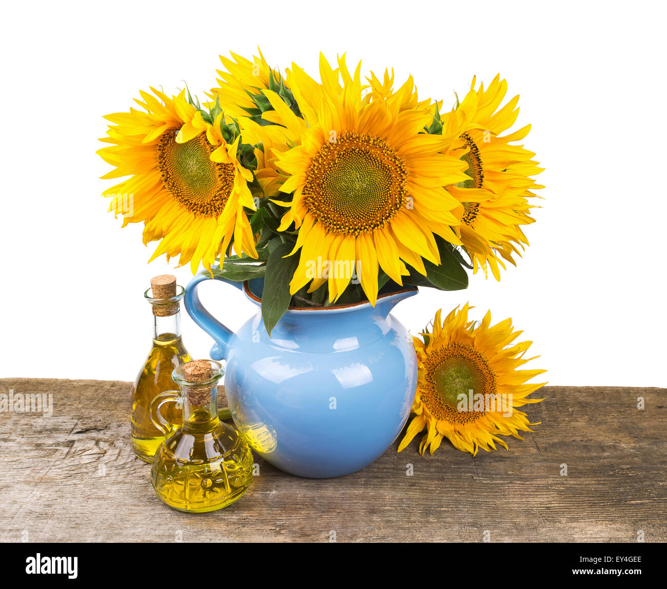 composition with sunflowers and sunflower oil on wooden desk Stock ...