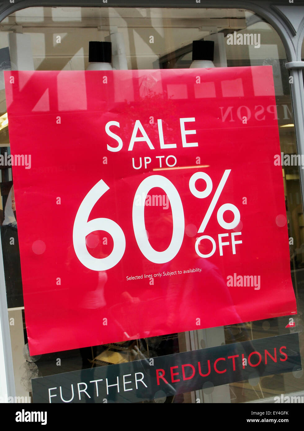 Sale poster in a shop window advertising 60% off Stock Photo - Alamy