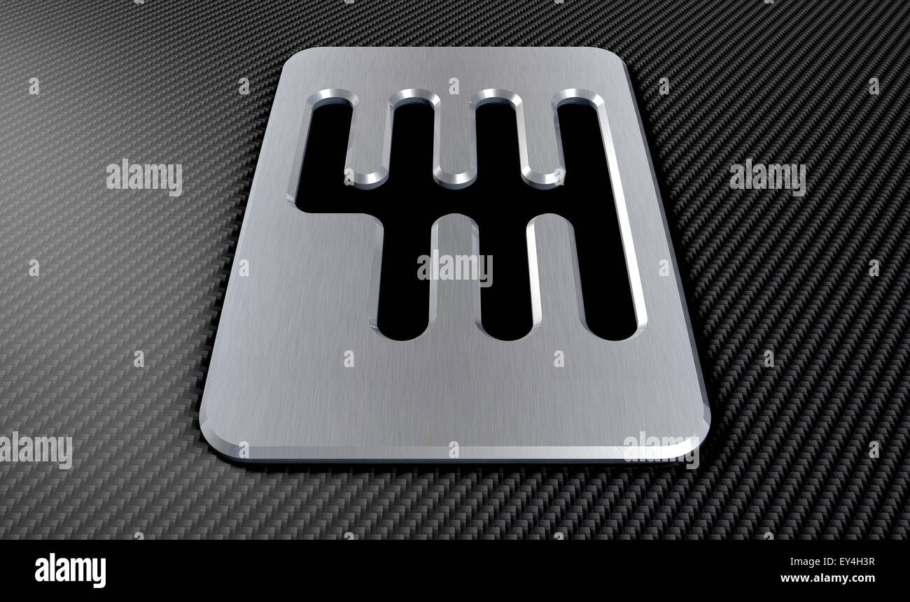 A steel chrome gear stick shift plate on a carbon fibre surface Stock ...