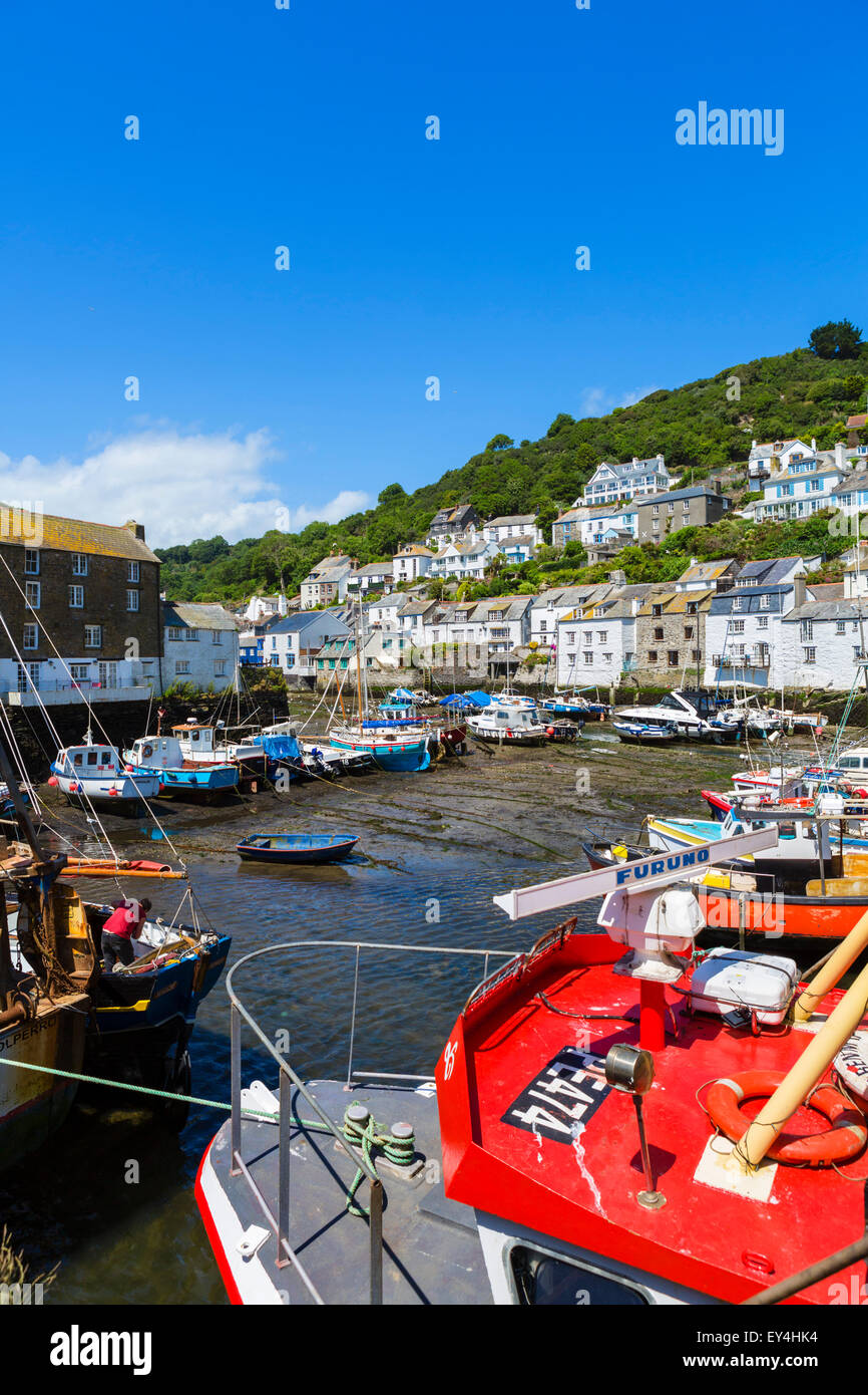 The harbour at low tide in the fishing village of Polperro, Cornwall ...