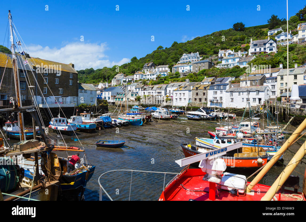 The harbour at low tide in the fishing village of Polperro, Cornwall ...