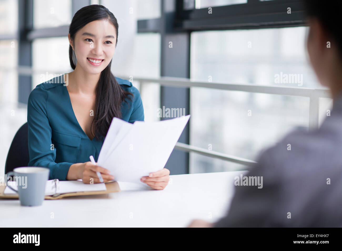 Young businesswoman conducting job interview Stock Photo - Alamy