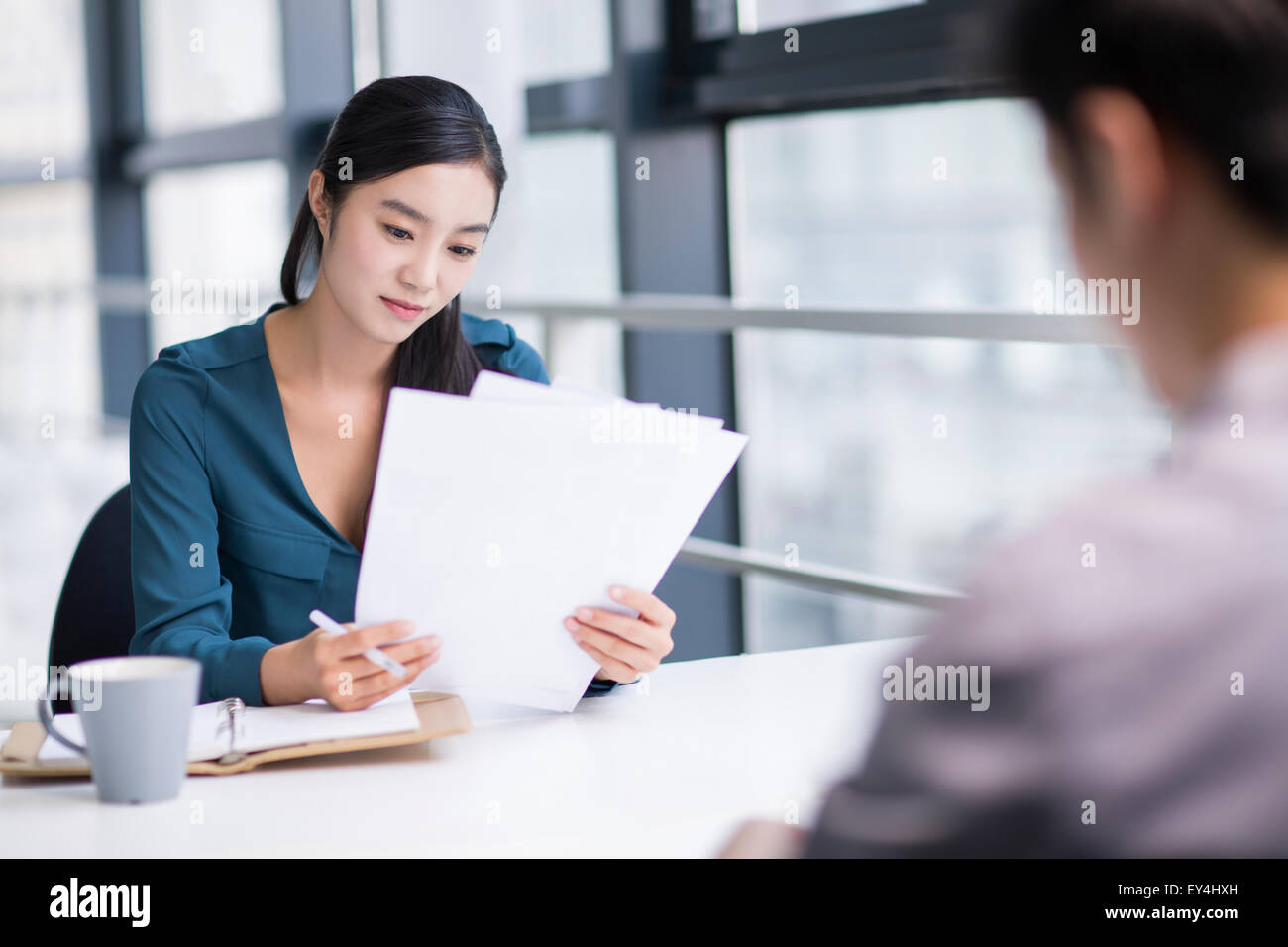 Young businesswoman conducting job interview Stock Photo - Alamy