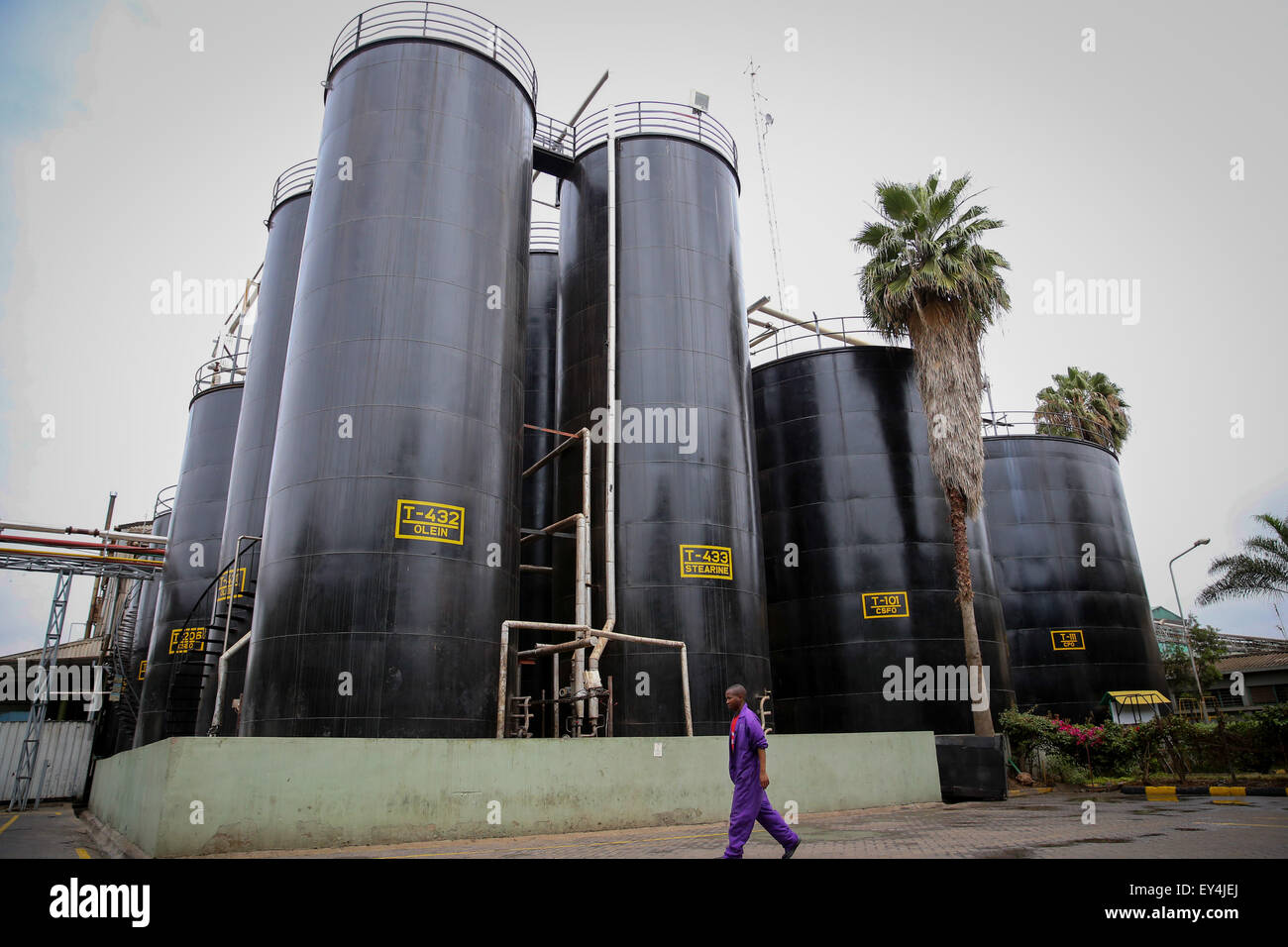 Worker walks past tanks hi-res stock photography and images - Alamy