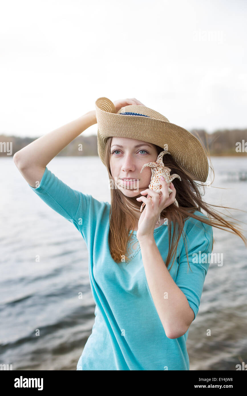 Girl with shell hi-res stock photography and images - Alamy