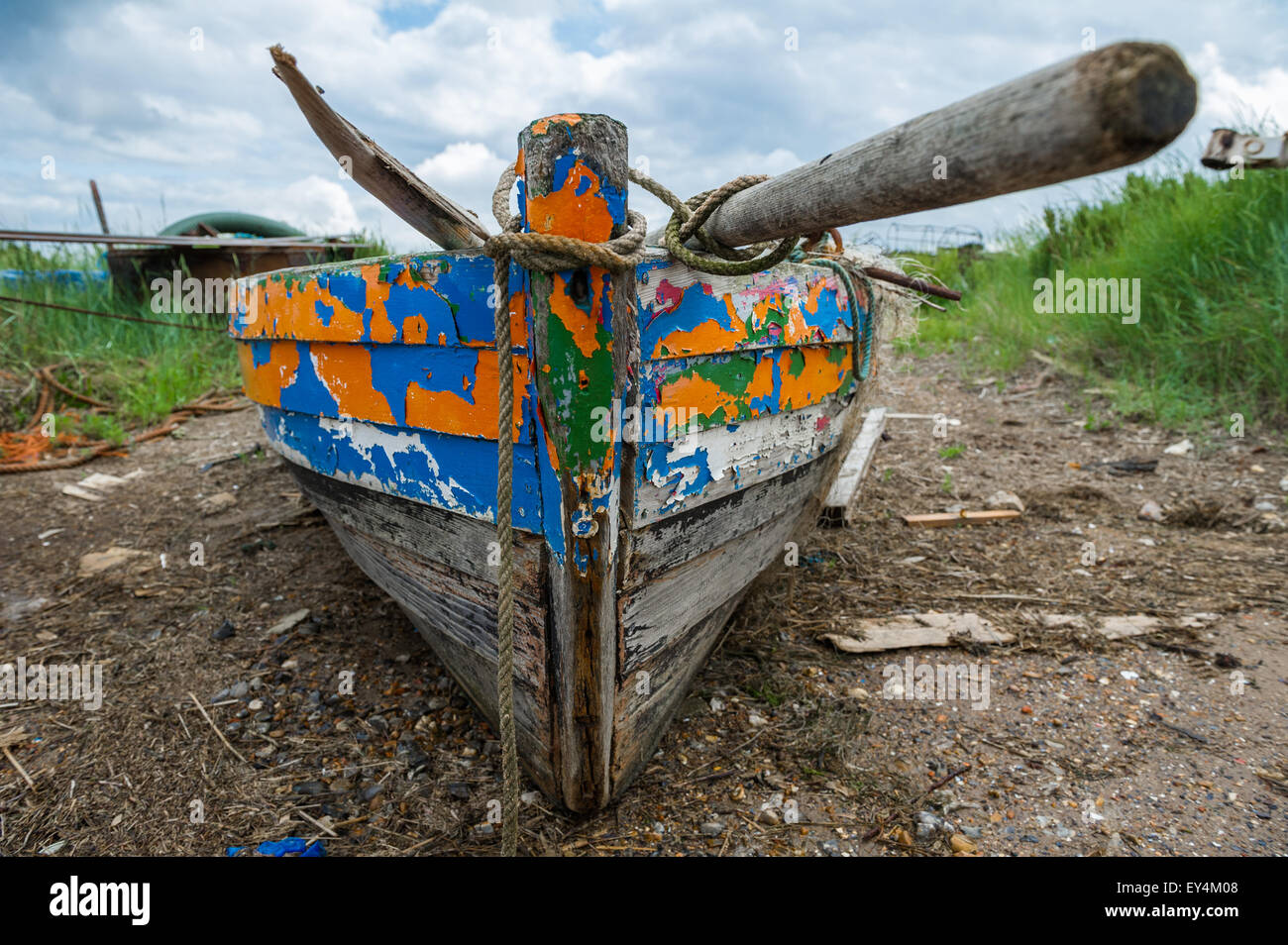 Old rotting wooden rowing boat with the layers of paint showing Stock ...