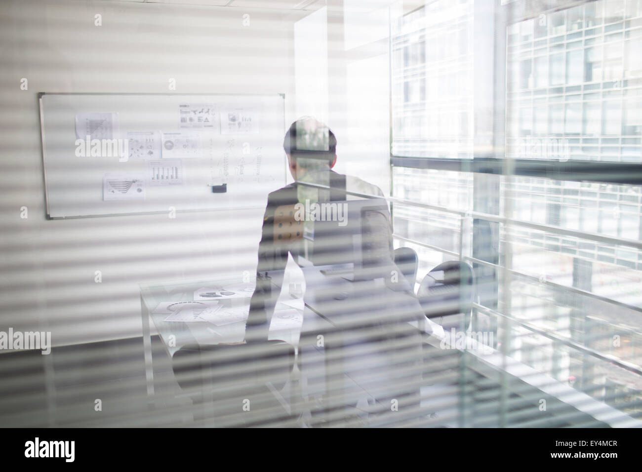 Young businessman thinking in meeting room Stock Photo - Alamy