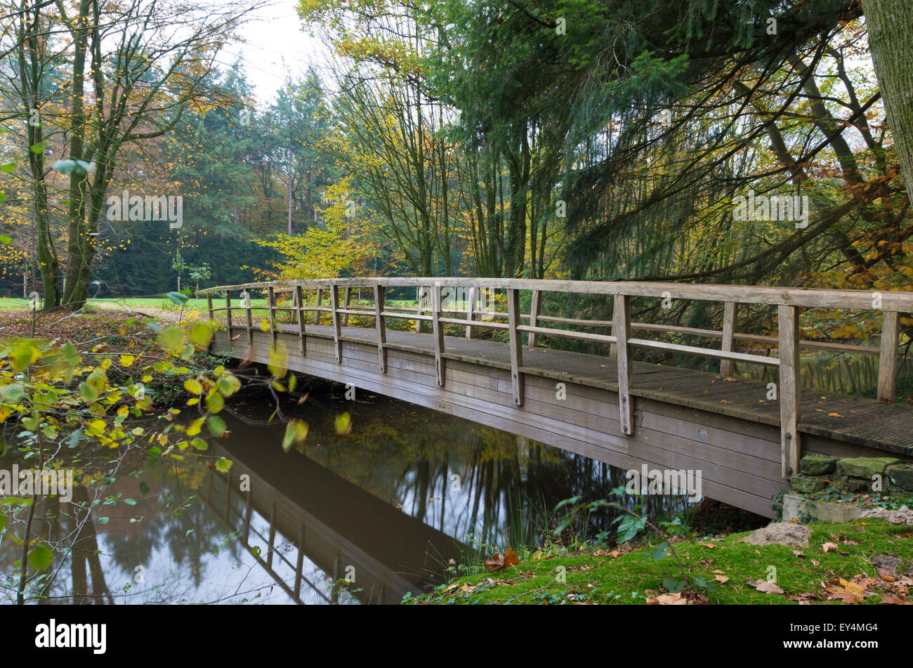 small wooden footbridge over a river Stock Photo - Alamy