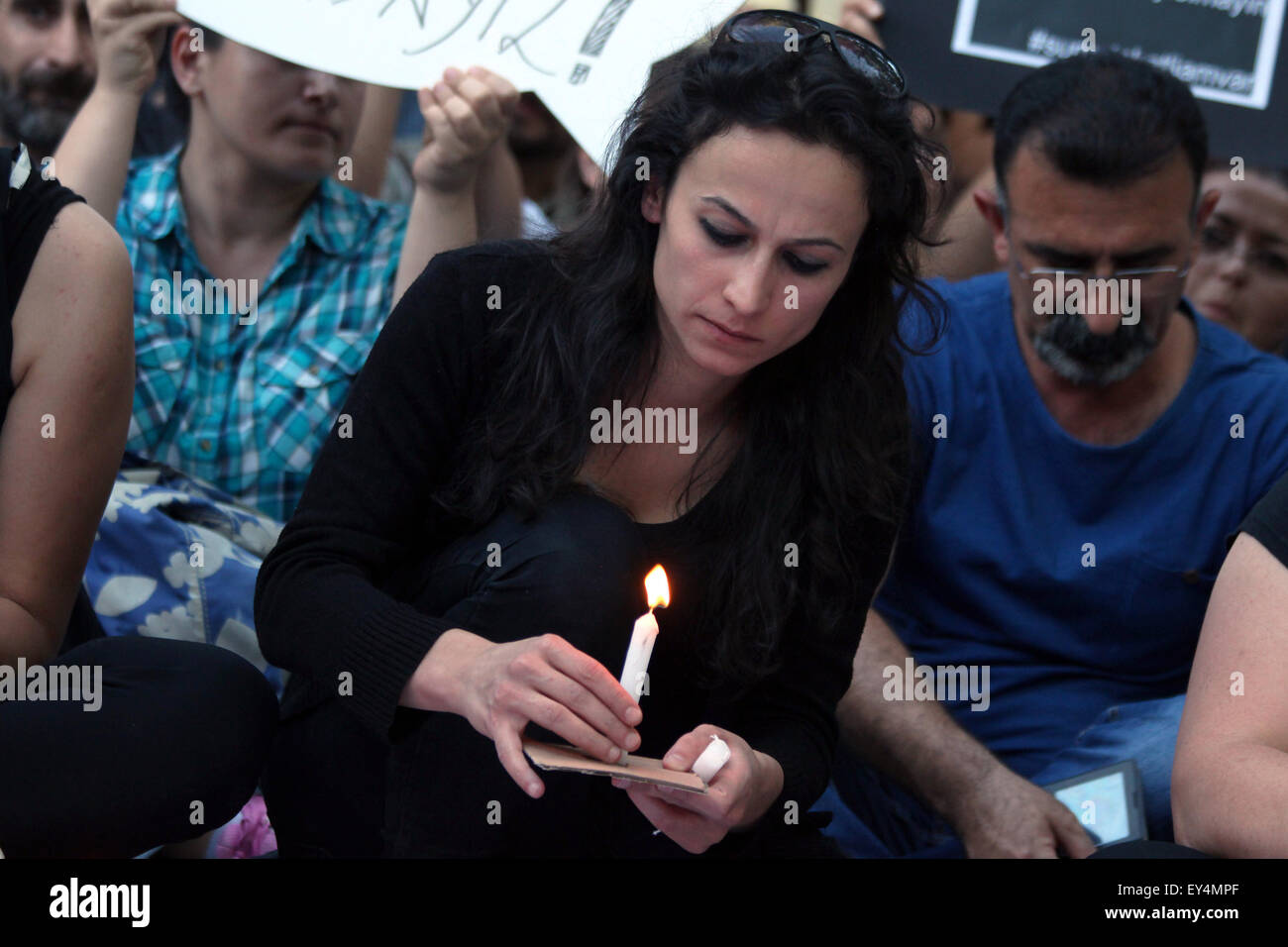 Ankara, Turkey. 21st July, 2015. Demonstrators lit candles for the ...