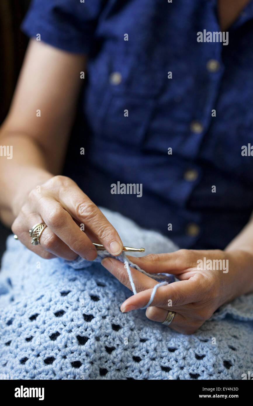 Close up picture of a Caucasian woman crocheting at home Stock Photo ...