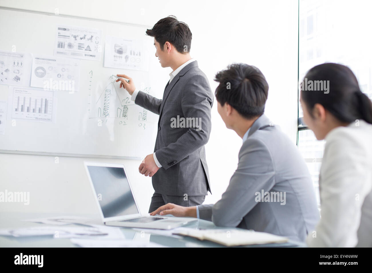 Young business person talking in meeting Stock Photo - Alamy
