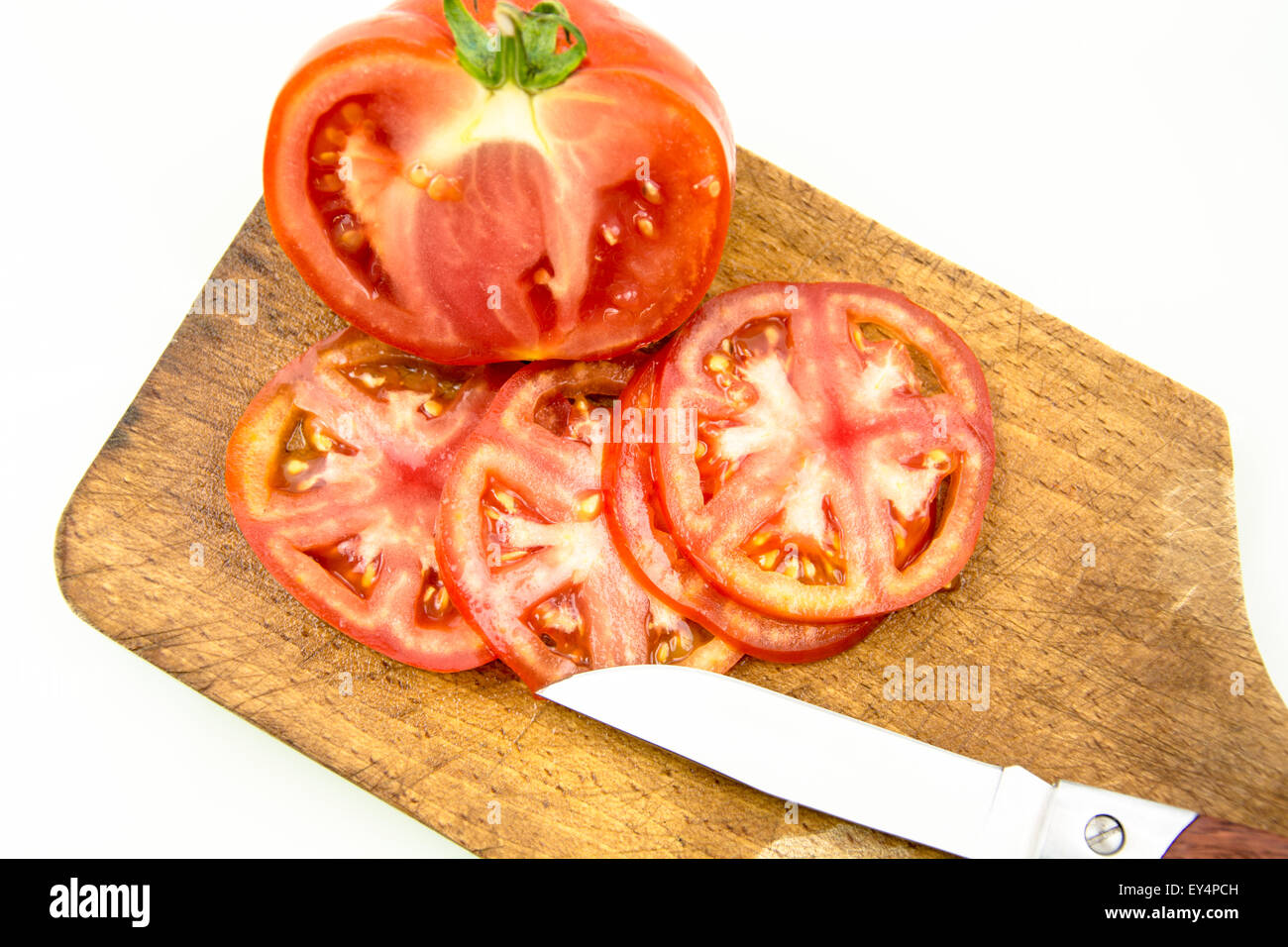 Slice of tomato in summer Stock Photo - Alamy