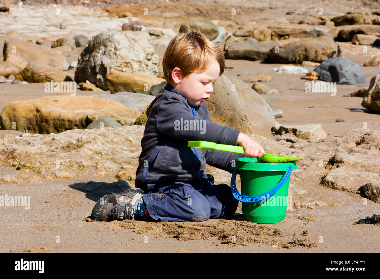 Boy making sandcastles hi-res stock photography and images - Alamy