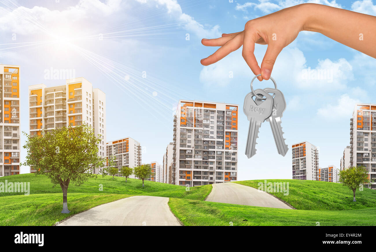 Hand with keys and city Stock Photo - Alamy