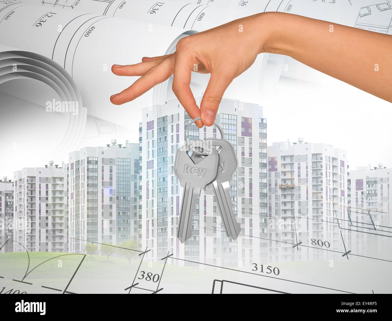 Buildings with hand holding keys Stock Photo - Alamy