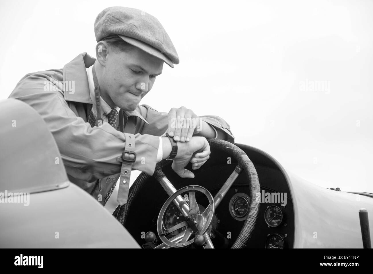 Actor dressed up in period costume with flat cap next to Bluebird ...
