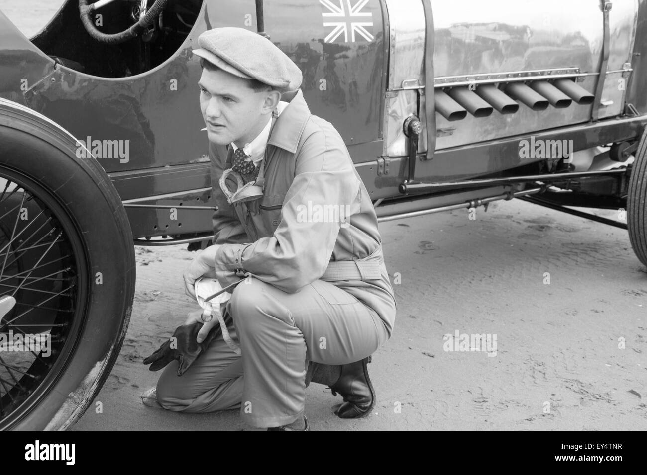 Actor dressed up in period costume with flat cap next to Bluebird ...