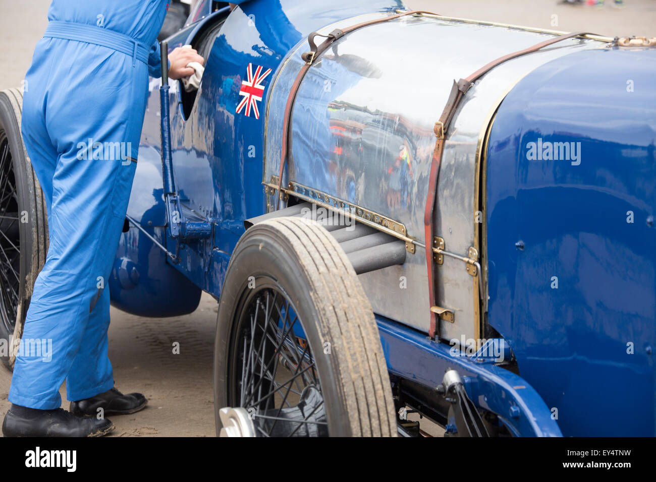 Driver Actor dressed up in blue overall next to Bluebird racing car on ...