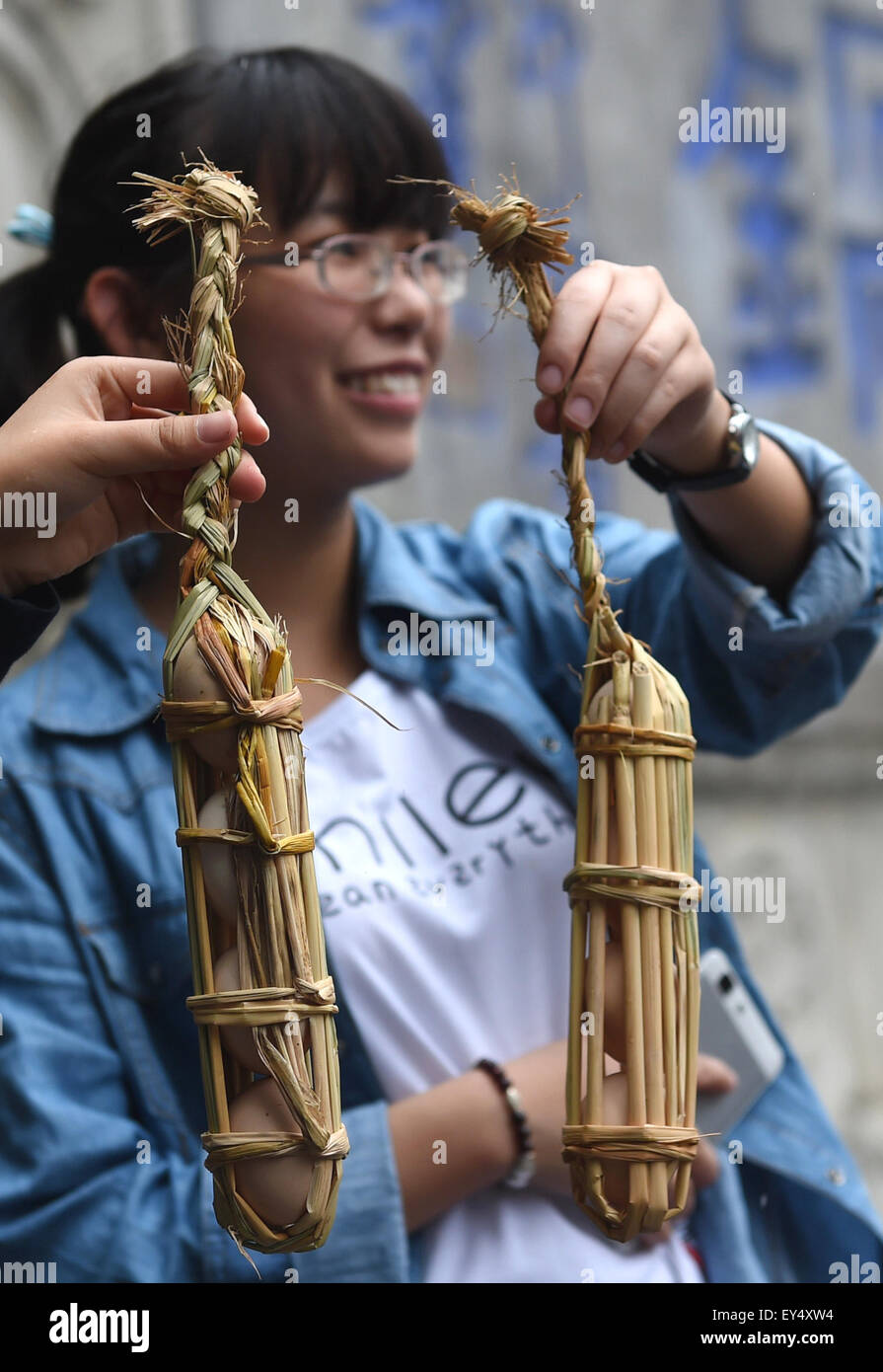 Tengchong, China's Yunnan Province. 21st July, 2015. A tourist shows ...