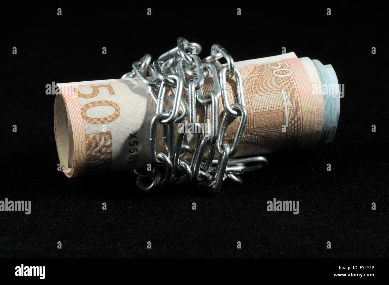 Money in chains Stock Photo - Alamy