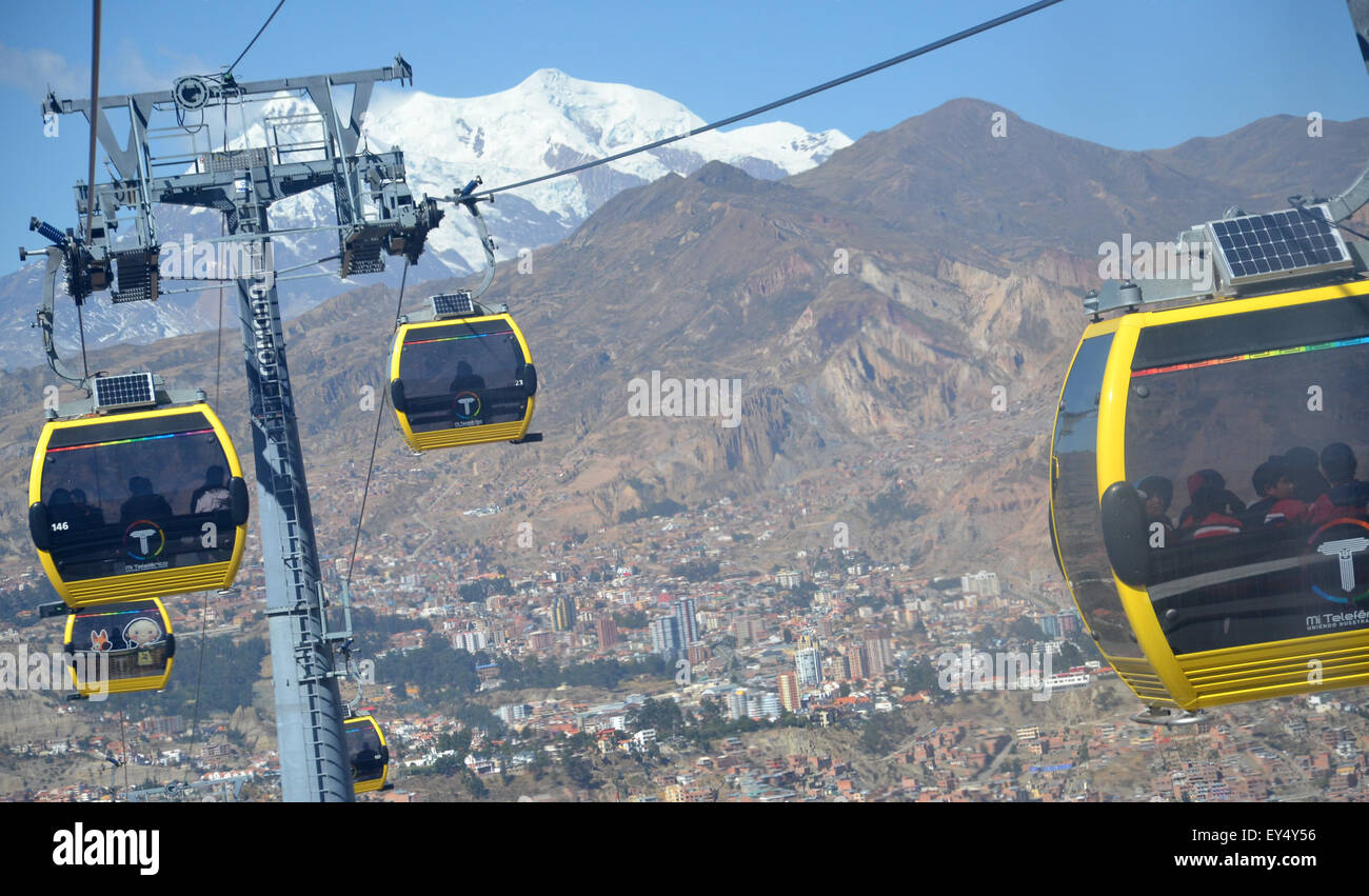Cable car cabins of the yellow line connect the cities of El Alto ...