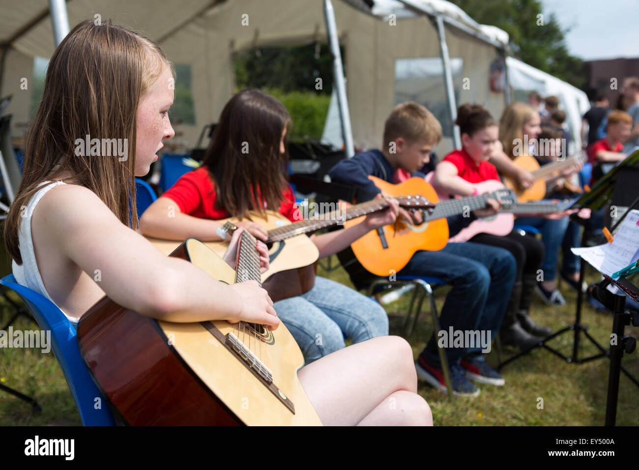 Children playing instruments hi-res stock photography and images - Alamy