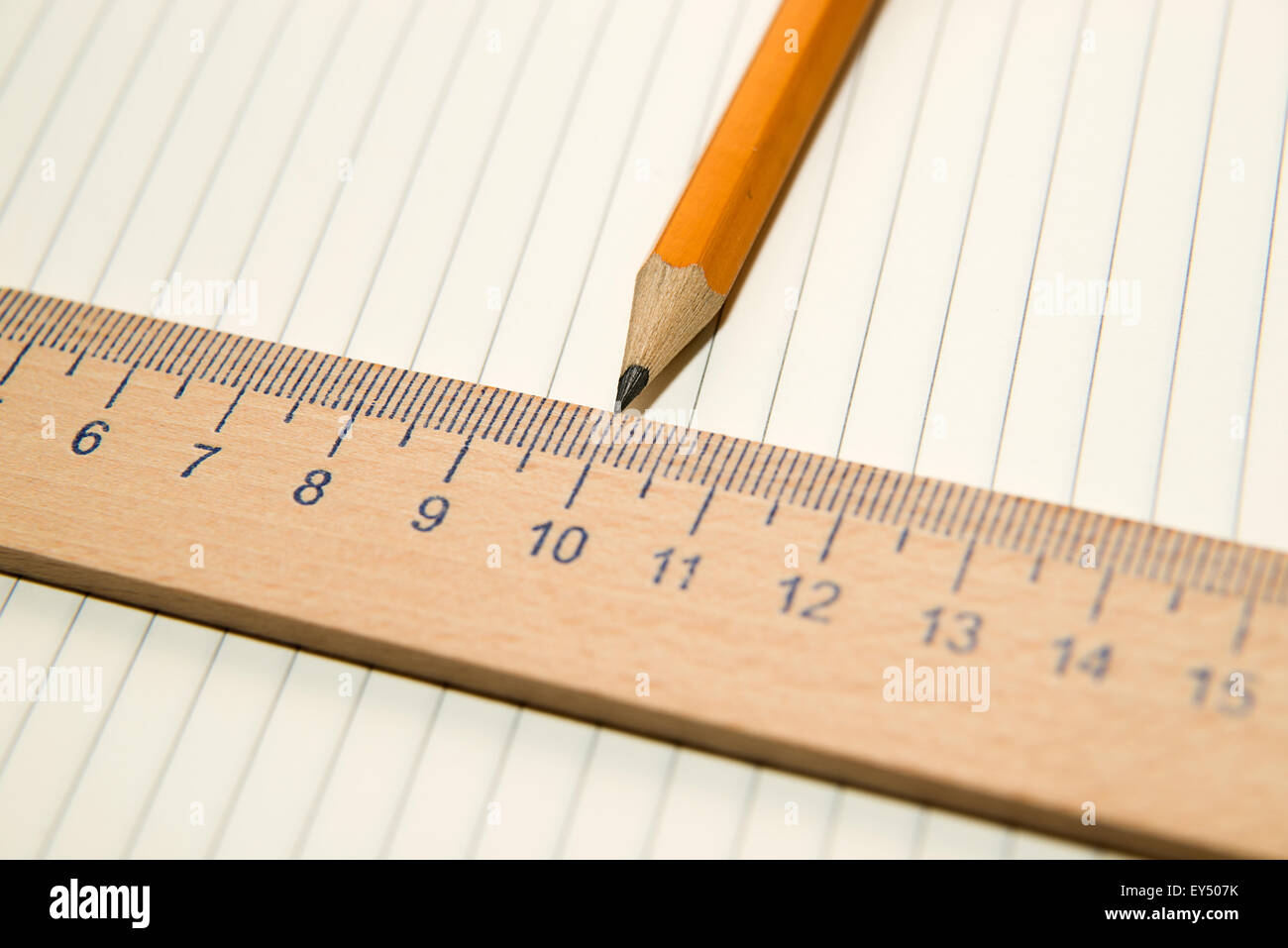 Notepad with a recording sheet, pencil and wooden ruler Stock Photo - Alamy