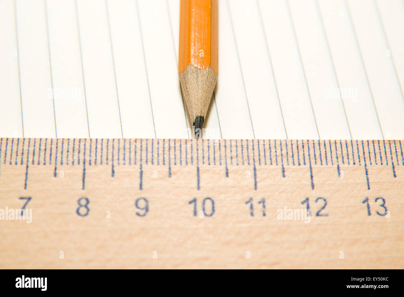 Notepad with a recording sheet, pencil and wooden ruler Stock Photo - Alamy