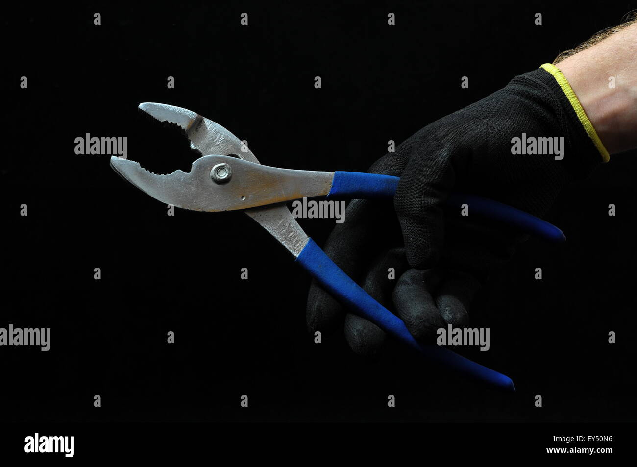 Hand holding working cutters hi-res stock photography and images - Alamy