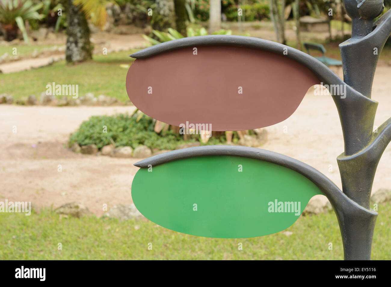 Two piece sign placed in a peaceful botanical garden Stock Photo - Alamy