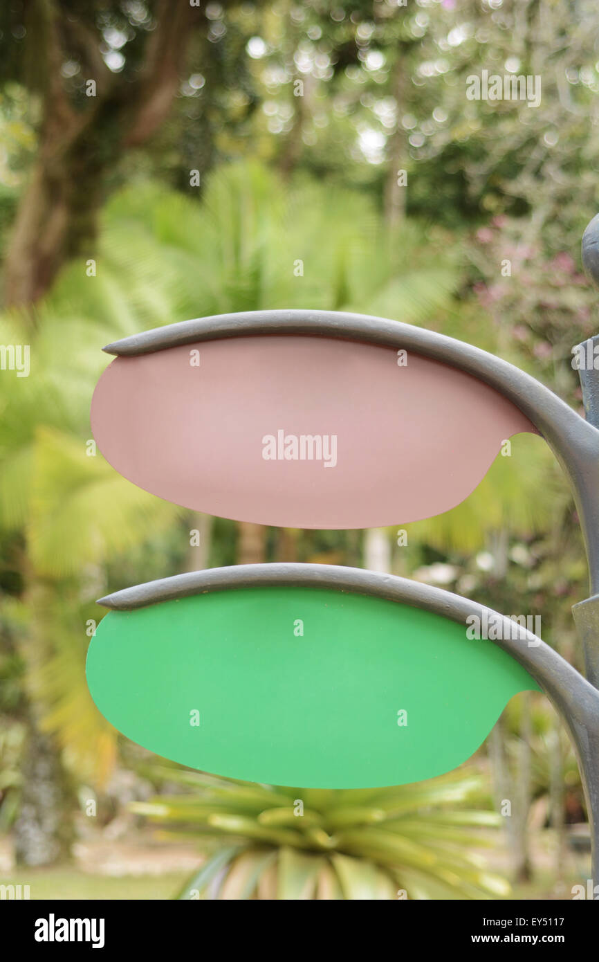 Two piece sign placed in a peaceful botanical garden Stock Photo - Alamy