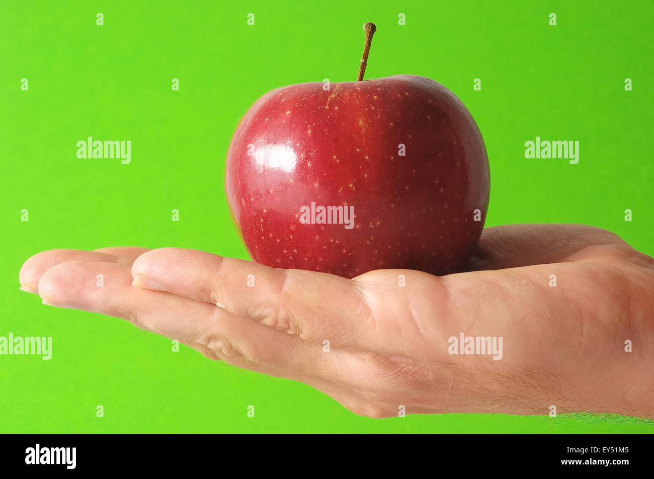 Apple on the Hand Stock Photo - Alamy