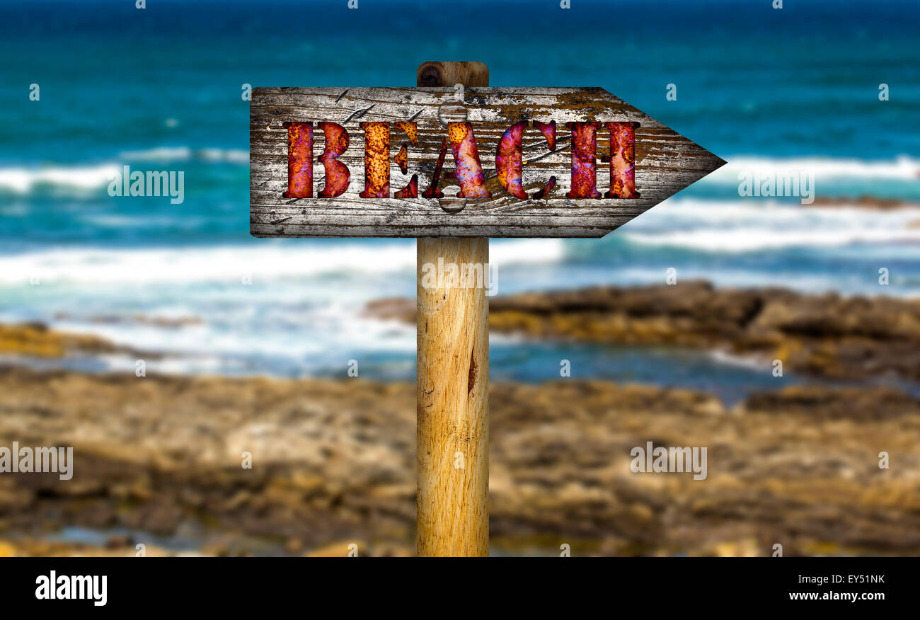 Worn wooden beach sign Stock Photo - Alamy