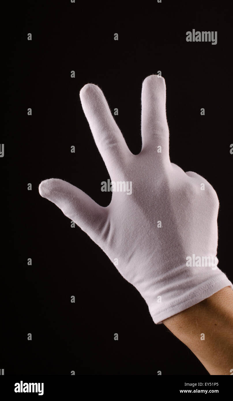Male hand with white gloves counting number three Stock Photo - Alamy