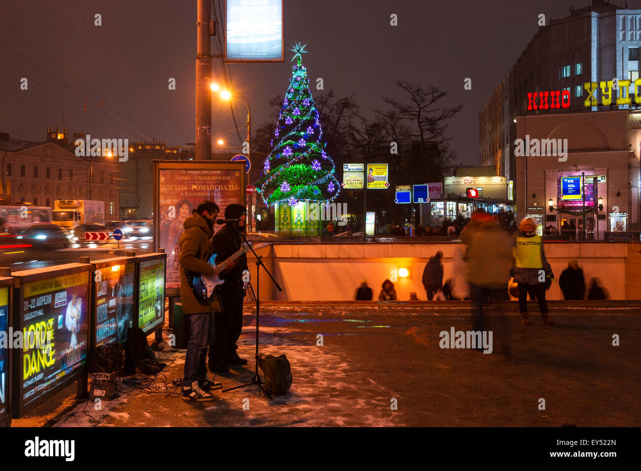 Musicians on Arbat square of Moscow at winter night. Cinema theater ...