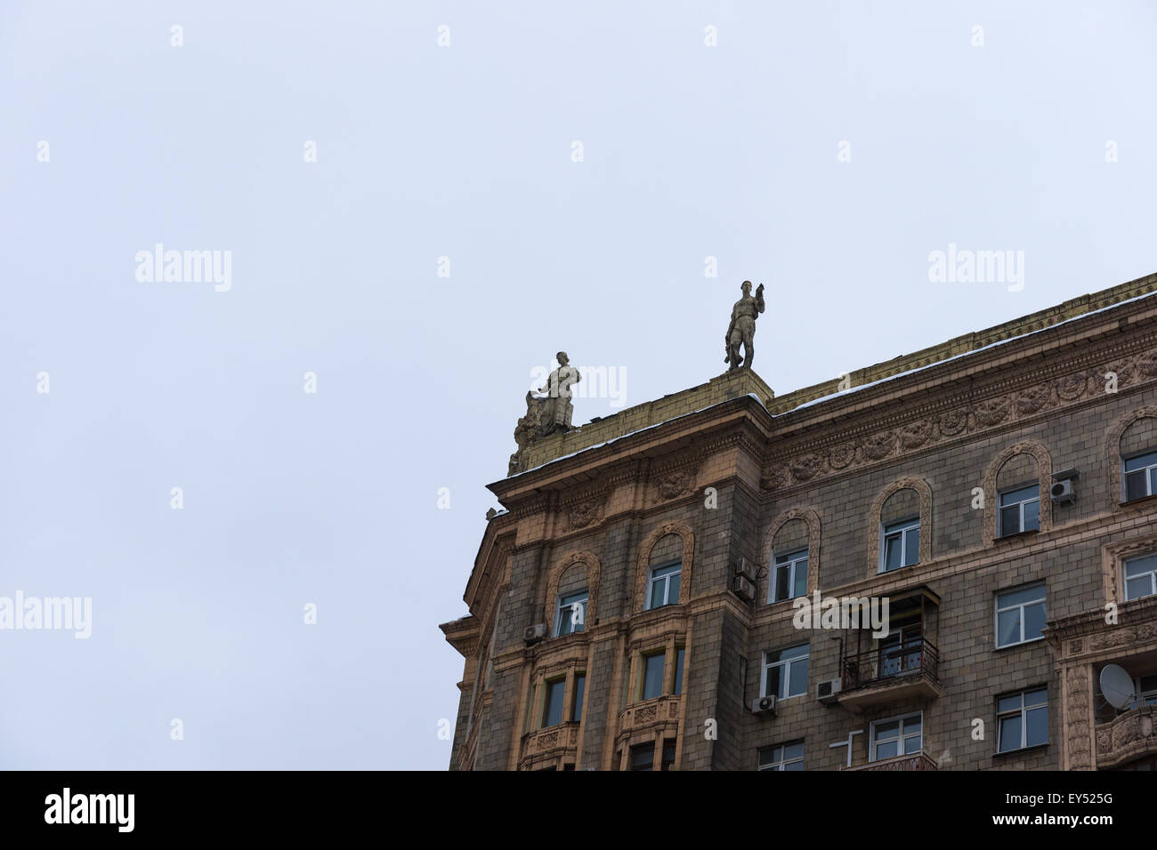 Details of old Stalin style architecture of Moscow. Statues on the roof ...