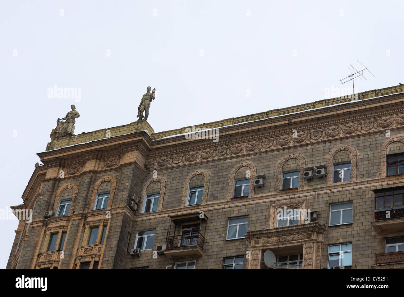 Details of old Stalin style architecture of Moscow. Statues on the roof ...