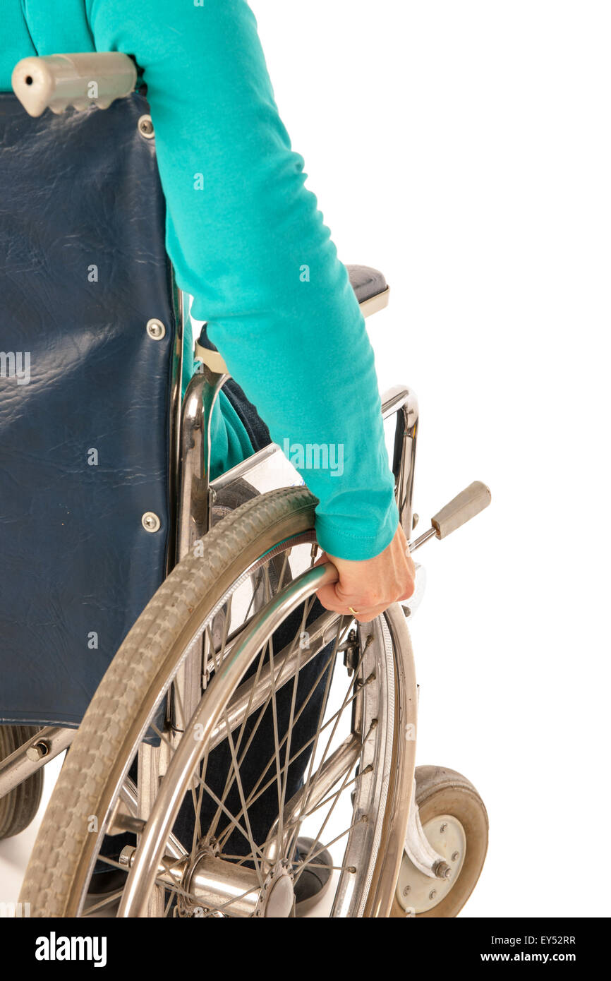 Person riding in wheelchair Stock Photo - Alamy