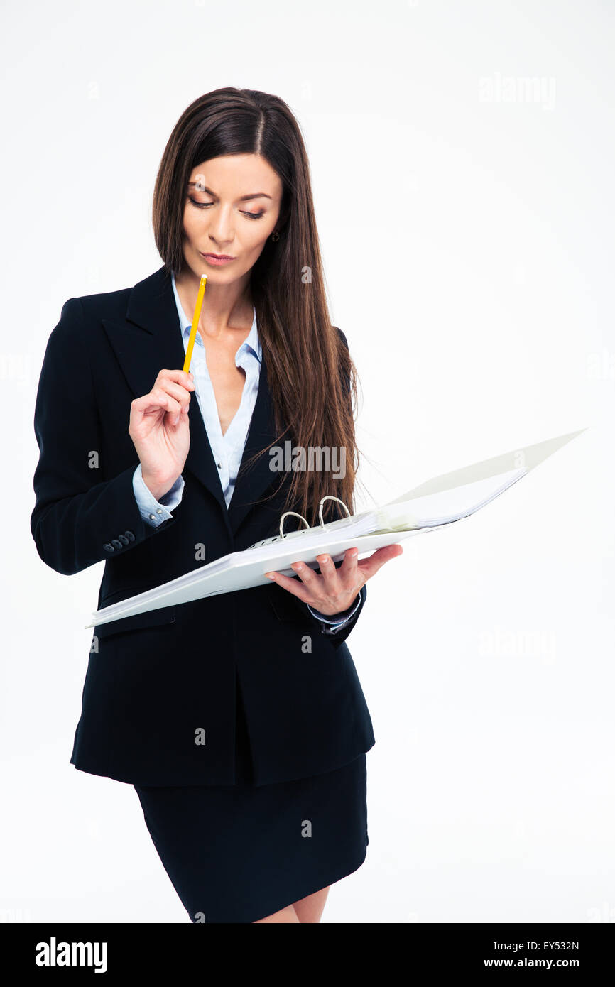 Pretty businesswoman reading documents in folder isolated on a white ...