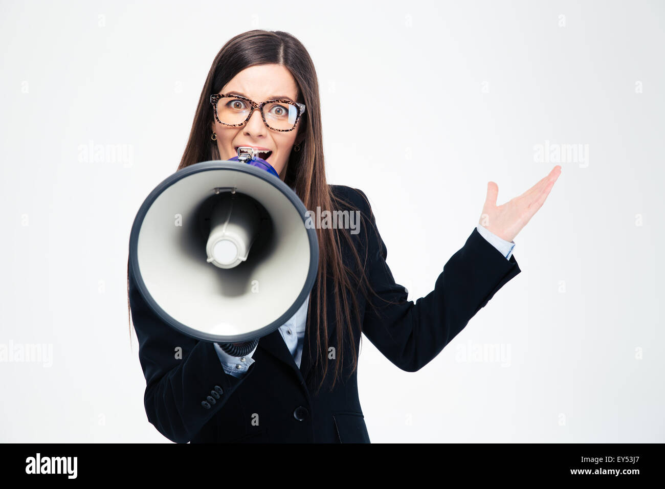 Businesswoman shouting in megaphone isolated on a white background ...