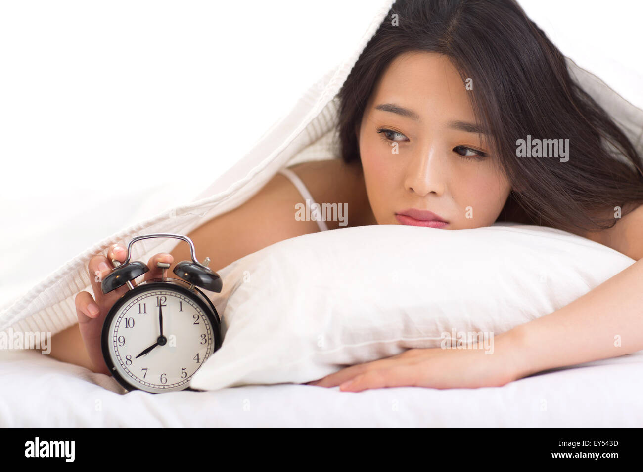 Young woman getting up Stock Photo - Alamy