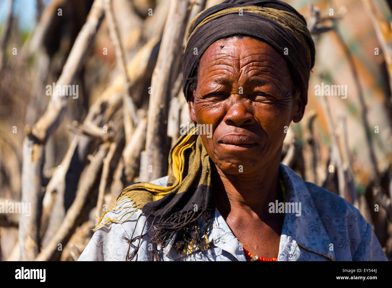 Bushman woman in front of a hut - Kalahari Botswana Stock Photo - Alamy