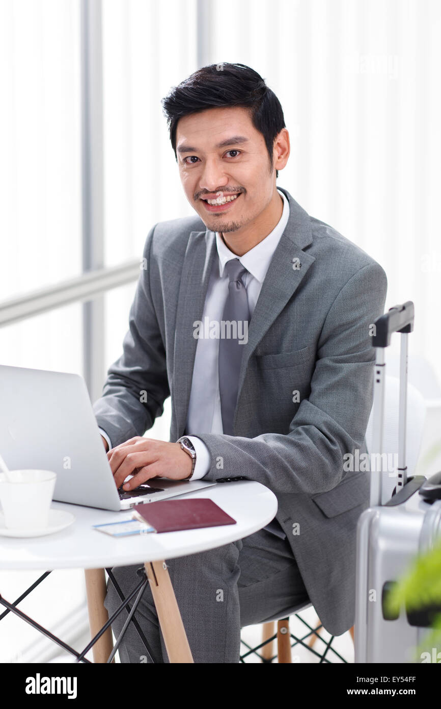 Portrait of businessman on trip Stock Photo - Alamy