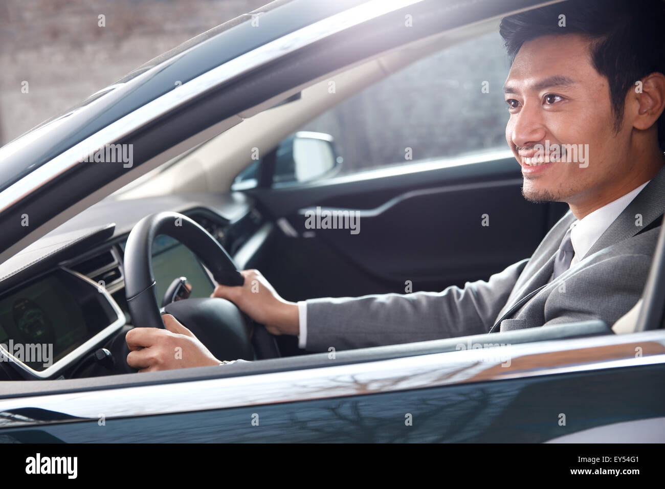 Businessman driving in car Stock Photo - Alamy