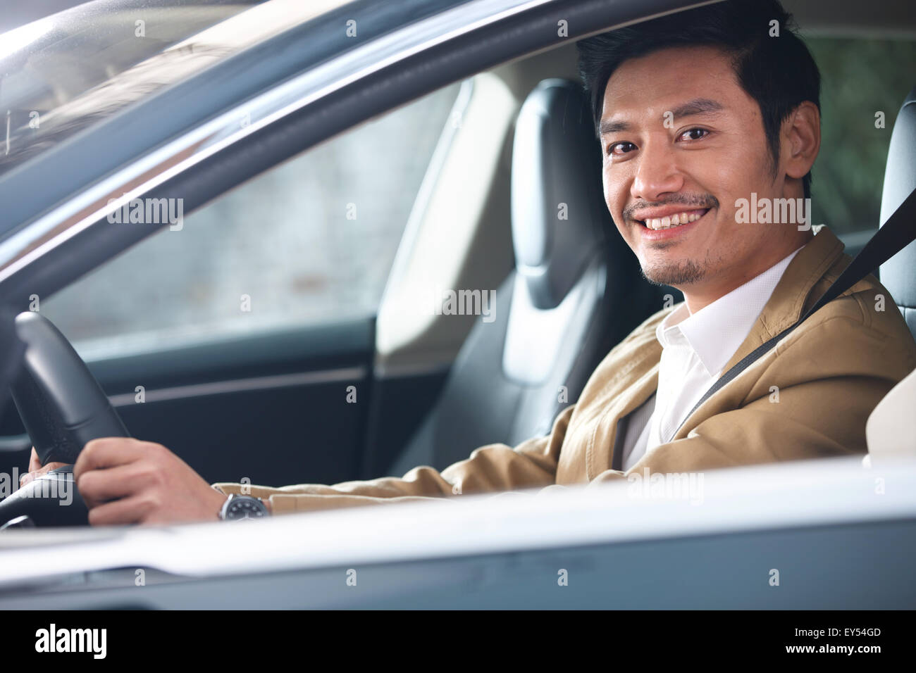 Businessman driving in car Stock Photo - Alamy