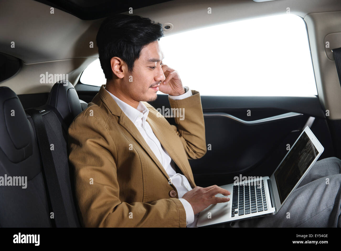 Businessman in car Stock Photo - Alamy