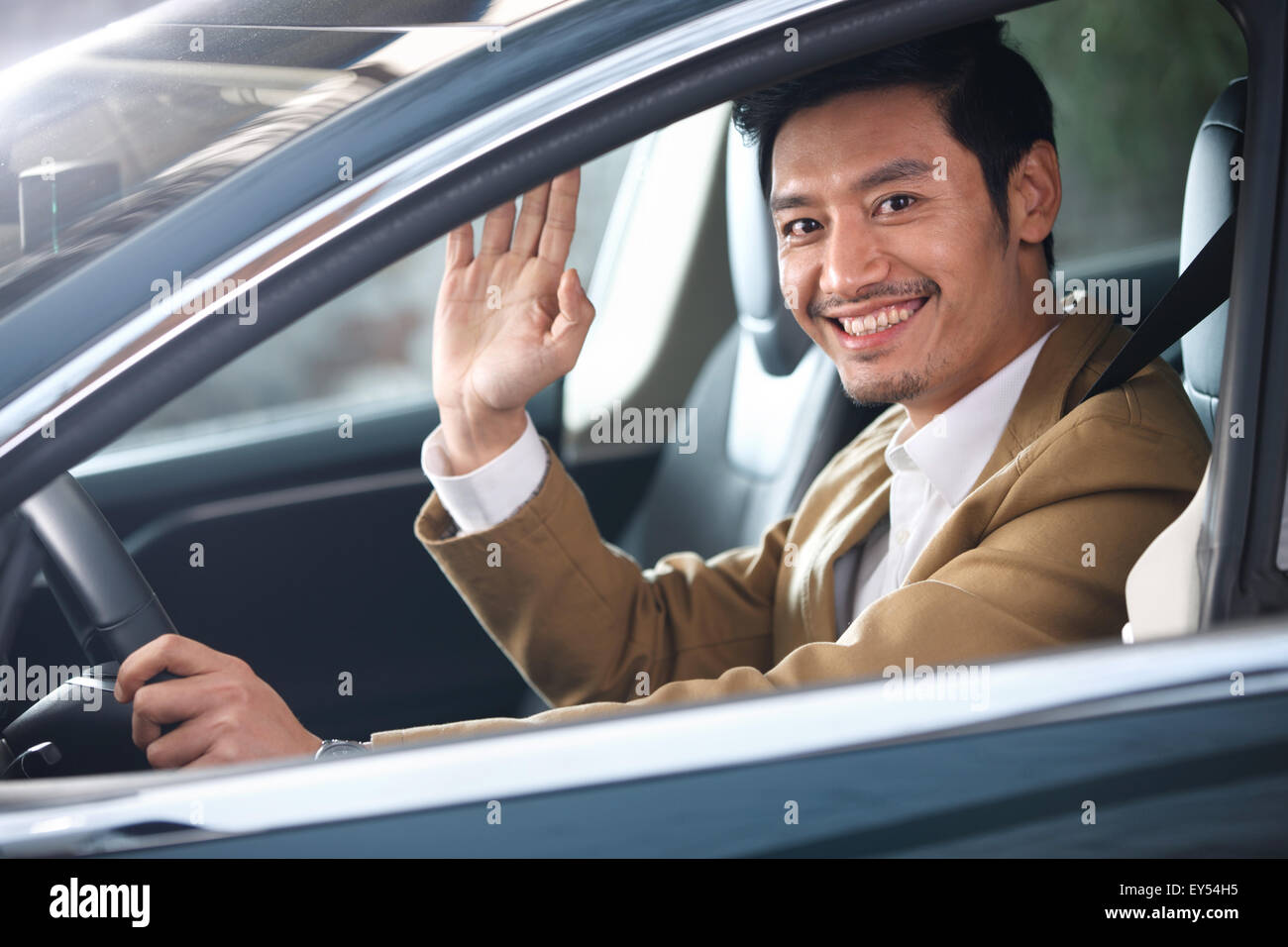 Businessman driving in car Stock Photo - Alamy