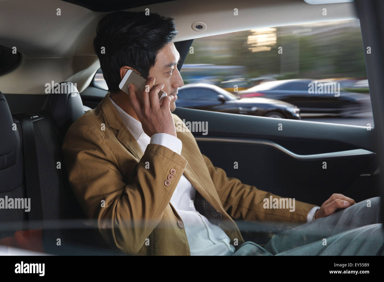 Business man calls in the car Stock Photo - Alamy