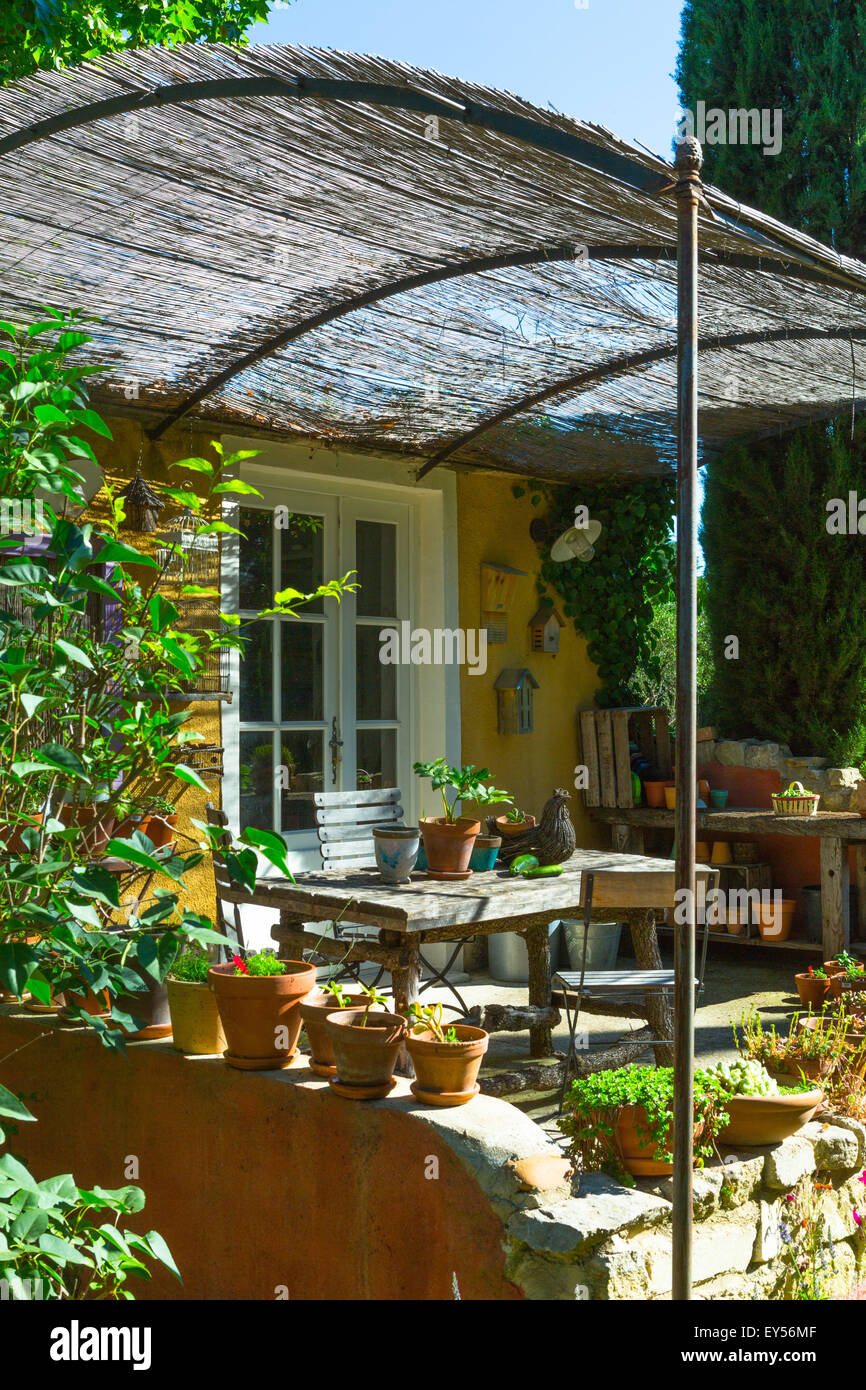 Shaded garden terrace Stock Photo - Alamy