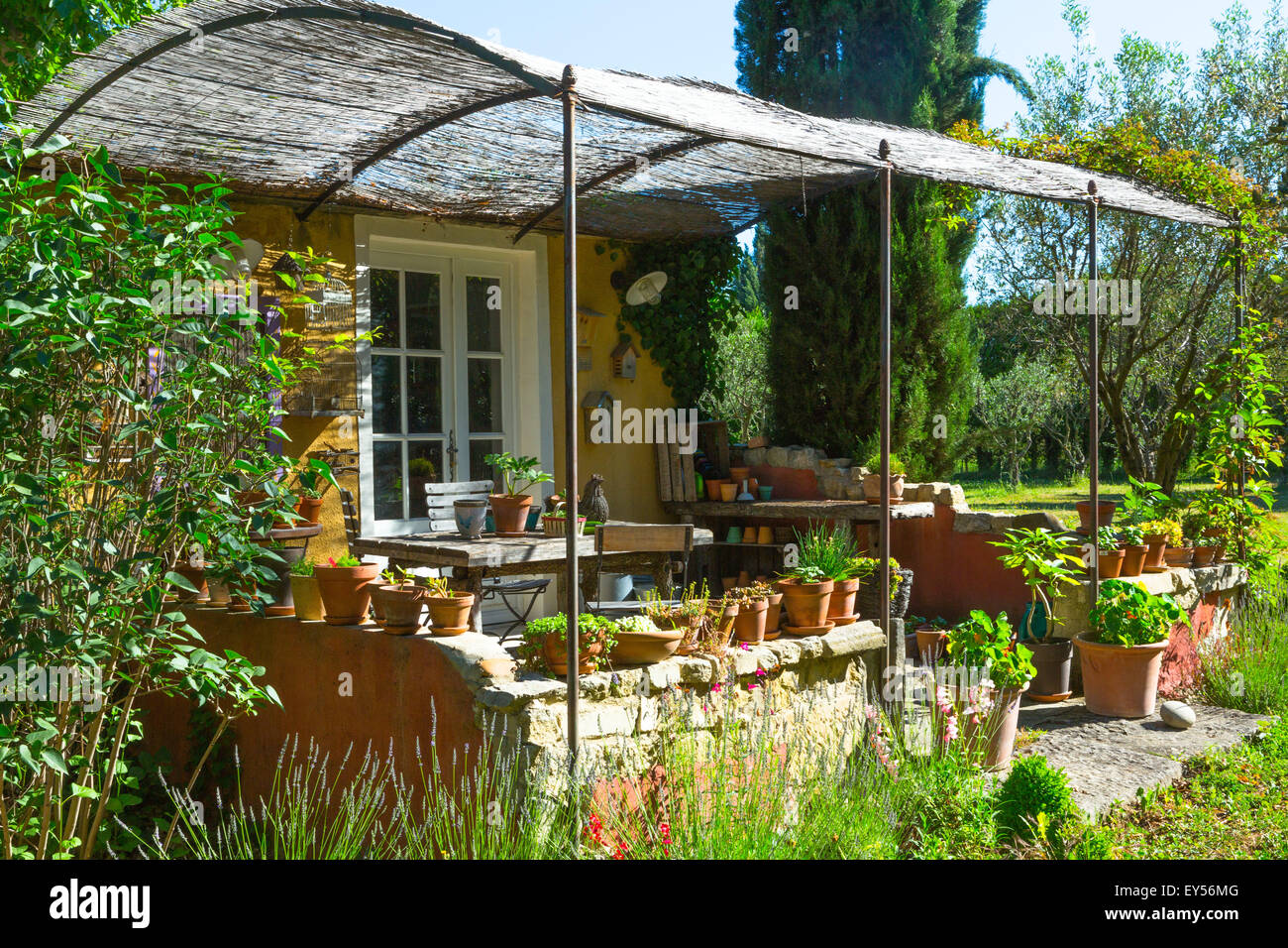 Shaded garden terrace Stock Photo - Alamy